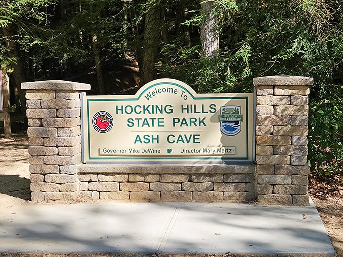 Not all who wander are lost, but this sign certainly helps. Ash Cave welcomes visitors with the promise of geological wonders that have been millions of years in the making. 
