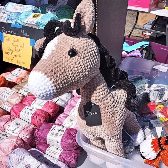 Crafting dreams in yarn form. This handmade horse stands proudly among skeins of possibility, waiting for someone with imagination to take the reins.