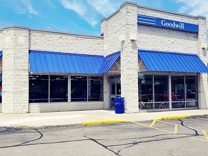 Bright blue awnings against crisp white walls – Goodwill's architectural invitation to spend hours hunting for bargains.