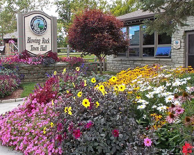Blowing Rock's Town Hall surrounded by flowers - proof that bureaucracy can actually look beautiful sometimes!
