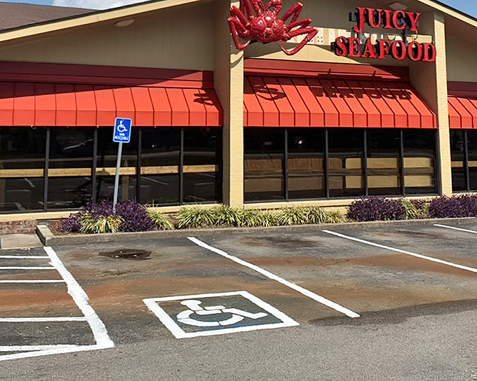 Juicy Seafood's bright red awnings and bold signage make a promise their kitchen definitely keeps—seafood that lives up to its name.