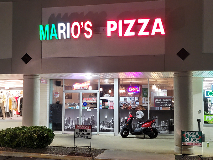 Mario's neon sign glows like Times Square transported to Rock Hill—a bright promise of New York-style pizza that delivers on every cheesy fold.