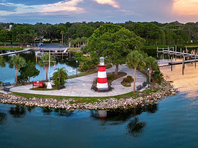Mount Dora's lighthouse stands like a cheery red-and-white sentinel, proving retirement paradise doesn't need an ocean—just a beautiful lake and budget-friendly surroundings.