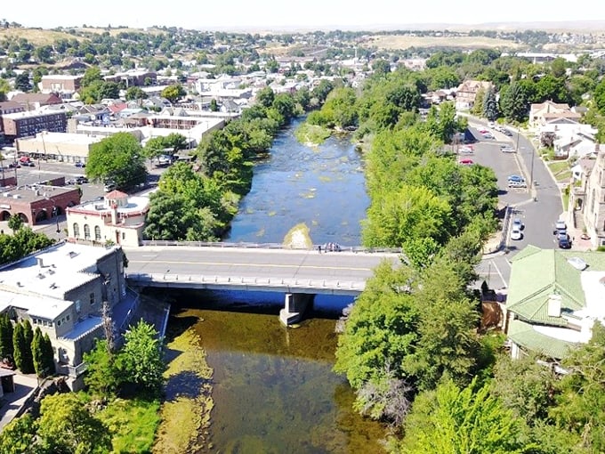 "River runs through it! Pendleton nestles between rolling hills like it's giving the landscape a warm, small-town hug."