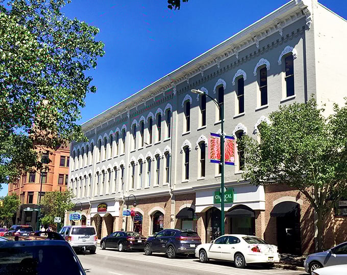Traverse City's colorful historic buildings stand proudly against the blue Michigan sky, inviting visitors to explore their treasures.