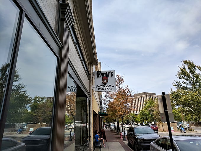 Morning light catches Dame's iconic sign – a promise of chicken and waffle matrimony that's converted more skeptics than a revival meeting.