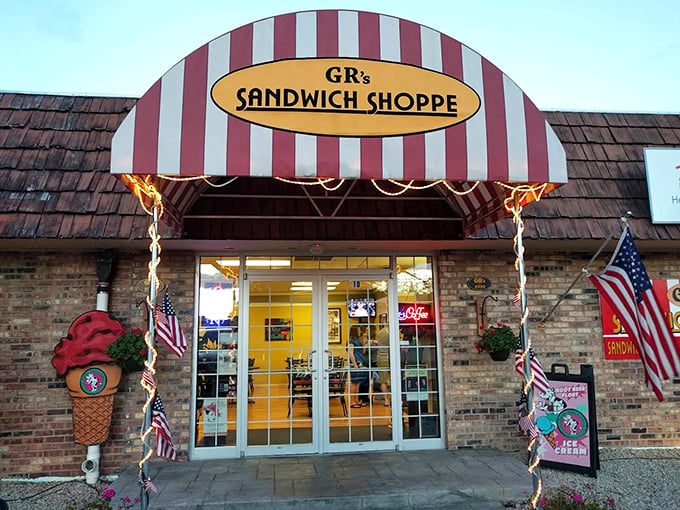 The classic red and white awning at GR's stands guard over sandwich perfection. No filter needed—just pure Wisconsin deliciousness.
