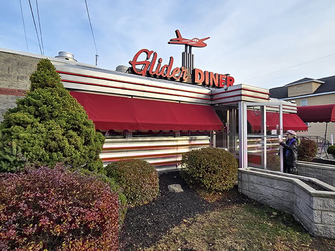 Red awnings and stainless steel siding—the universal language for "abandon your diet, all ye who enter here." The Glider Diner doesn't just serve food; it serves memories.