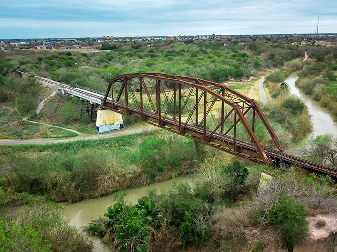 That rusty railroad bridge isn't just crossing water – it's connecting Harlingen's industrial past to its laid-back present.