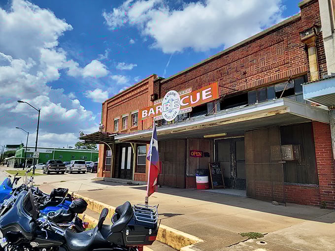 The Texas flag flies proudly outside Louie Mueller. Even the building looks seasoned with decades of perfect smoke.