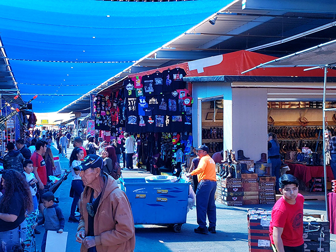 Sunlight filters through blue canopies, creating the perfect backdrop for deal-hunting at Phoenix's legendary swap meet. Bring sunscreen and negotiating skills!