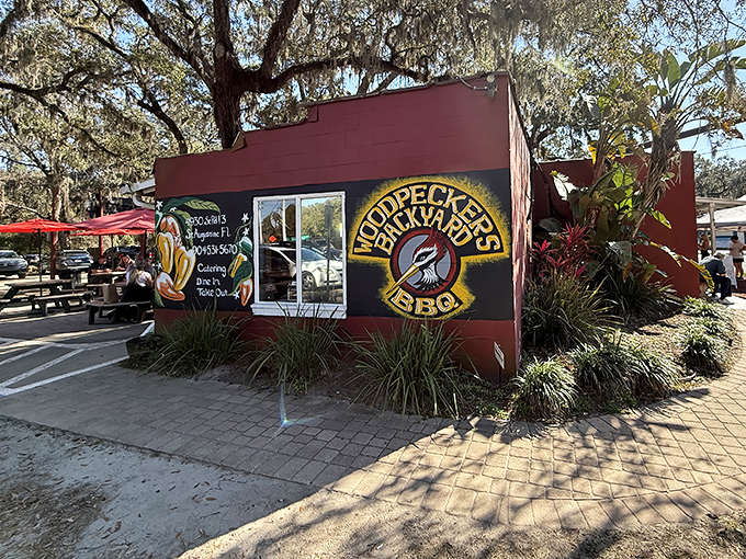 Woodpecker's colorful mural and outdoor seating practically scream "slow down and stay awhile" – Florida barbecue at its most inviting.