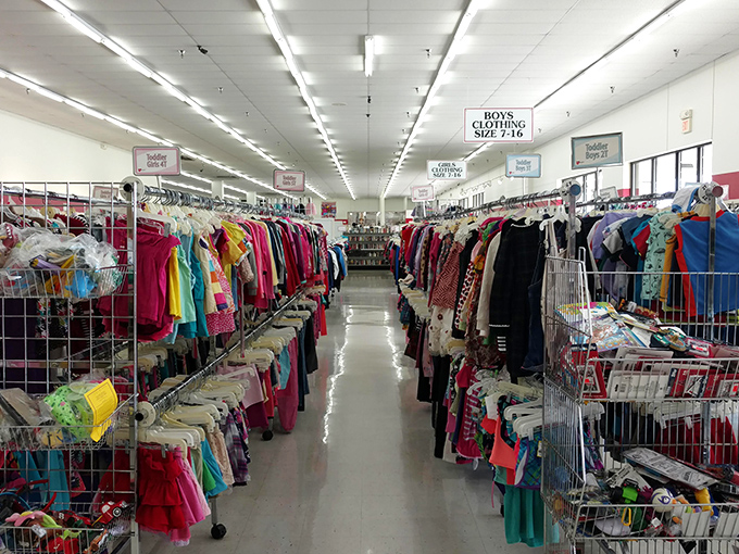 A rainbow of previously-loved garments awaits new adventures. That turquoise blouse might have stories to tell.