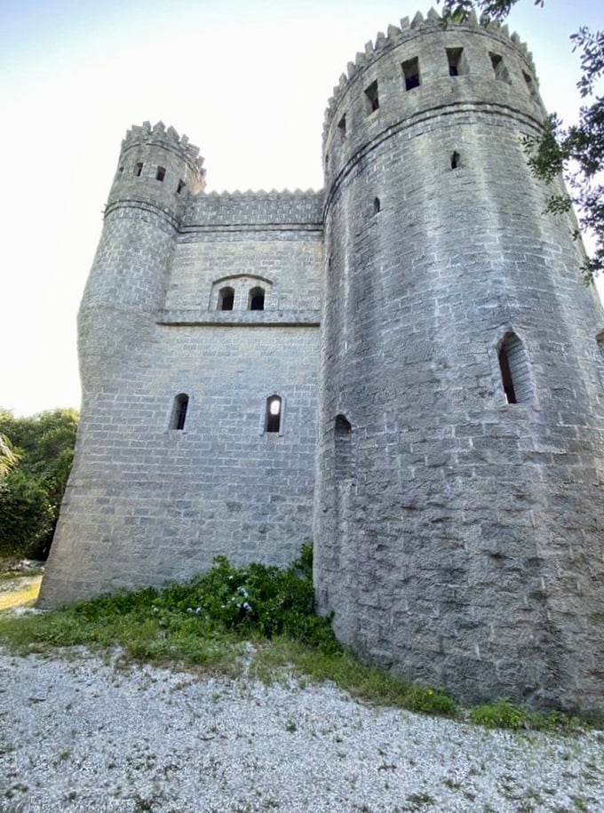 From this angle, the castle's impressive stonework reveals itself. Those aren't movie props—that's real craftsmanship bringing Ireland to the Sunshine State.
