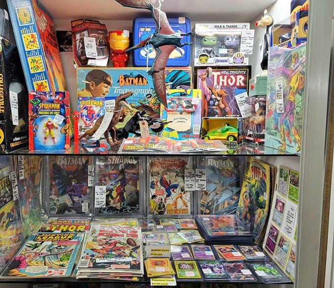 Holy collectibles, Batman! This comic book shrine showcases superhero treasures spanning decades, from vintage Batman to Thor's mighty adventures.