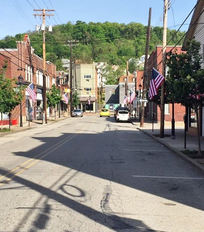 American flags line Millvale's streets, where small-town patriotism meets walkable convenience in a community that remembers its roots while embracing its future.