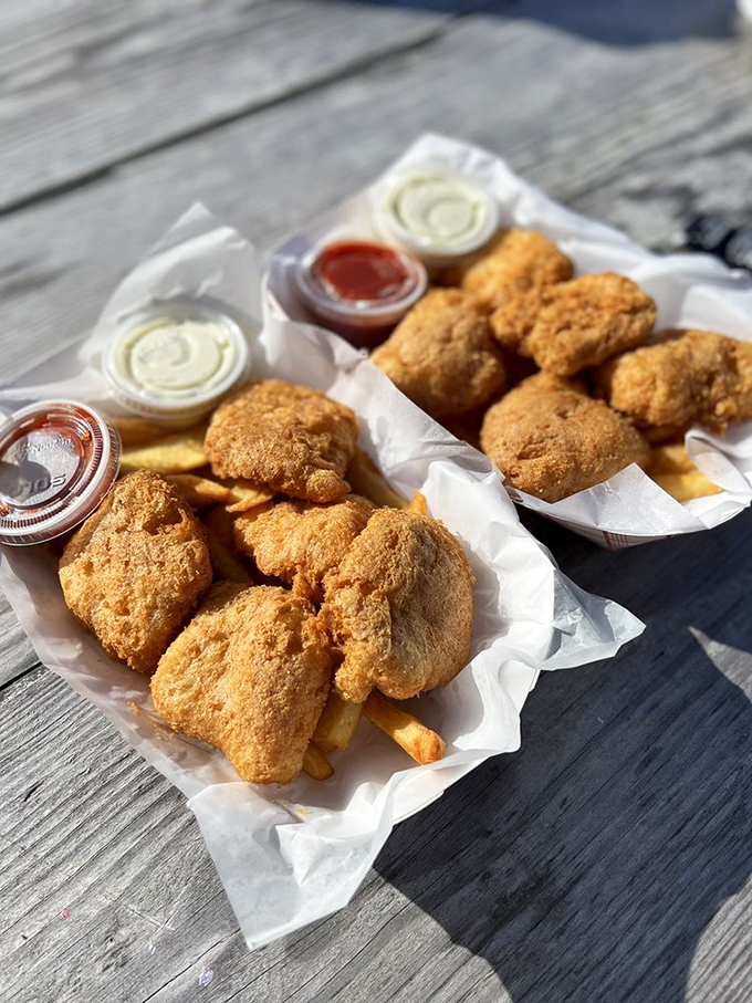 Golden treasures nestled on a bed of fries. These chunks of albacore tuna wear their crispy armor with pride, ready to make your taste buds stand at attention.