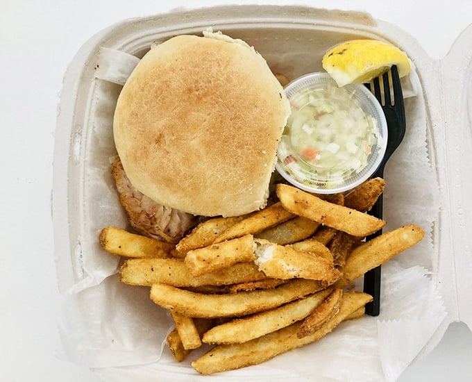 The star of the show arrives! This grouper sandwich with crispy fries is Florida's edible sunshine – simple, satisfying, and worth every mile driven.
