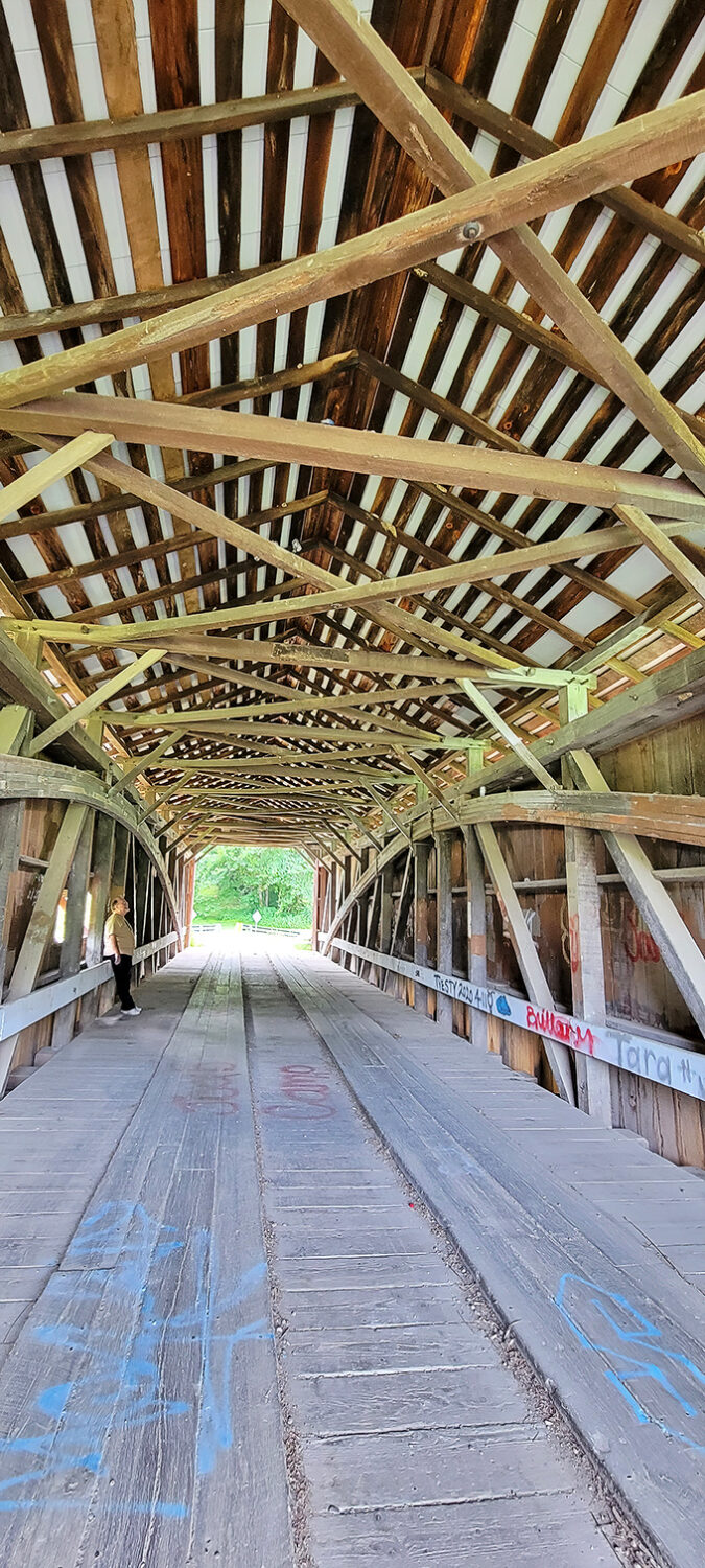 Look up! The intricate wooden lattice work overhead isn't just architectural showing off—it's 19th-century engineering genius at work.