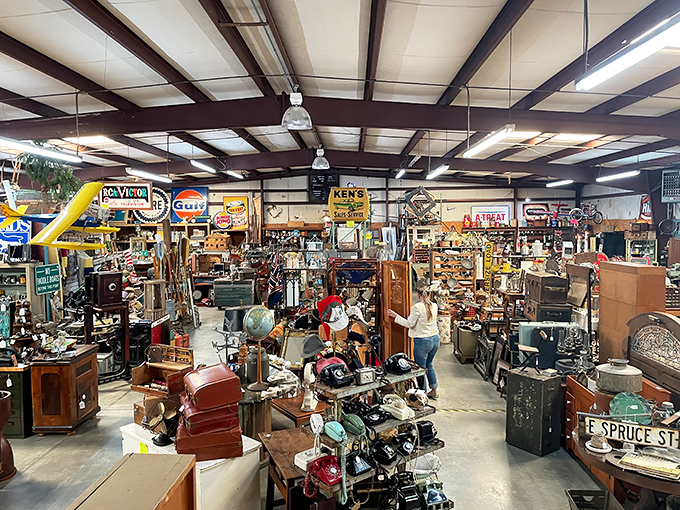 Not your average shopping aisle! This wonderland of collectibles features everything from farm equipment to furniture, all arranged in delightful "organized chaos."