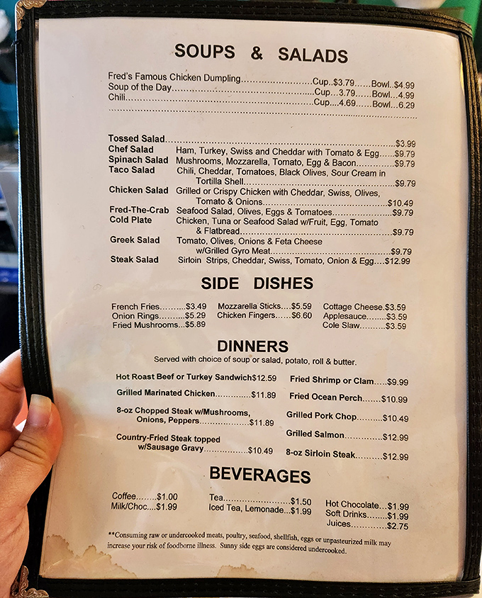 A menu that doesn't need fancy fonts or pretentious descriptions—just honest food at honest prices. The country fried steak beckons from the bottom right like an old friend.