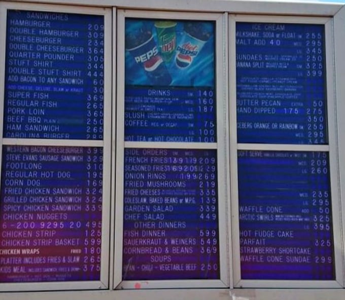 The menu board tells a story of American comfort food evolution. No fancy fonts or pretentious descriptions—just straightforward deliciousness waiting to happen.