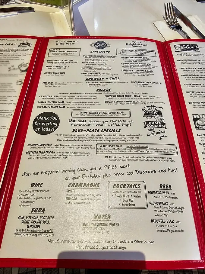 A menu that reads like a greatest hits album of American comfort food. No QR codes here—just laminated pages of timeless classics waiting to be rediscovered.