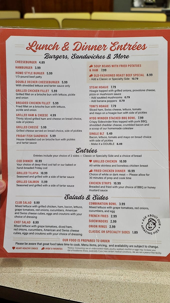 A menu that doesn't need fancy fonts or pretentious descriptions—just honest food at honest prices with little hearts marking their specialties.