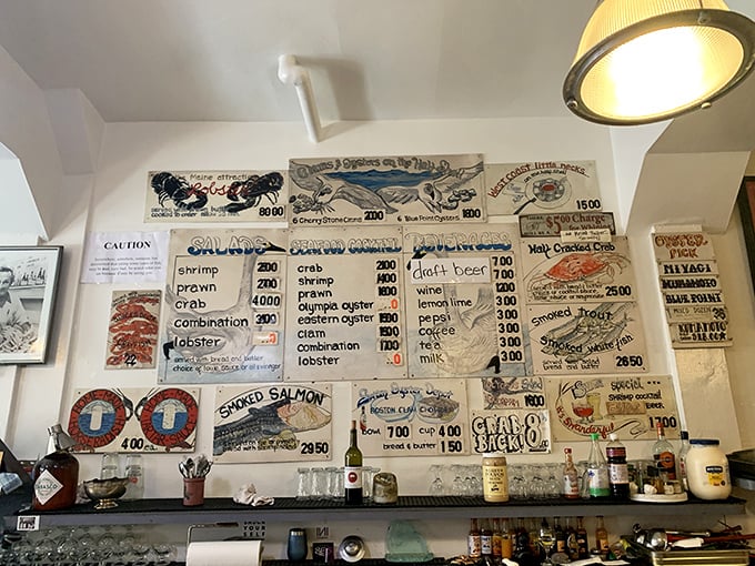 The handwritten menu board – a culinary treasure map where X marks the spot for oceanic delights. No fancy fonts needed when the food speaks this loudly.