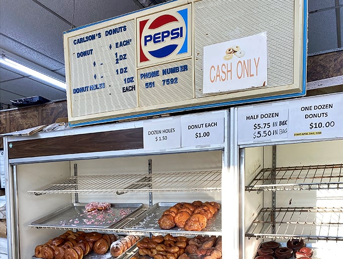 That vintage menu board is a time machine to when donuts cost pocket change and Pepsi was the beverage of champions. Cash only—some traditions never change.