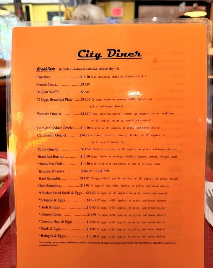 This no-nonsense orange menu is a roadmap to happiness—breakfast served all day is civilization at its finest.