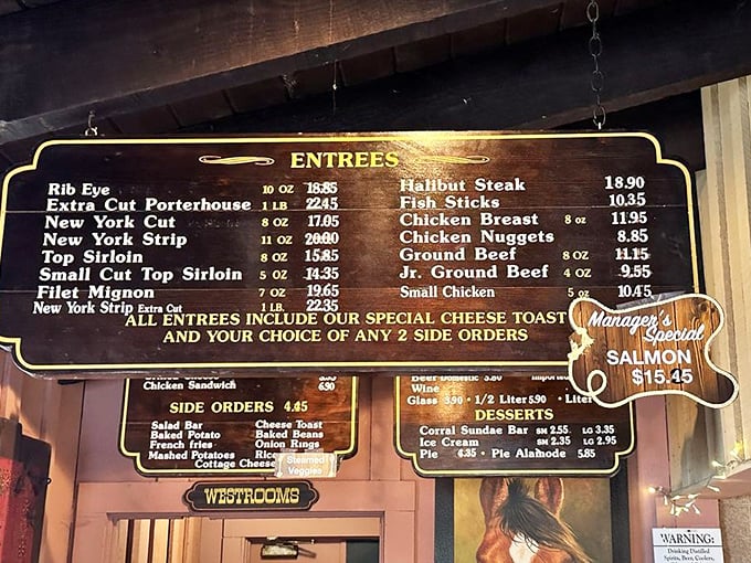 This menu board tells you everything you need to know—straightforward steaks, reasonable prices, and the promise of that legendary cheese toast with every entrée.