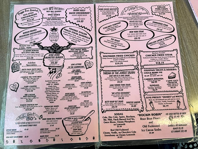 This pink menu isn't just a list of food—it's a roadmap to happiness with destinations like "Buddy Holly Bacon Cheeseburger" and "Frankie Avalon French Dip."