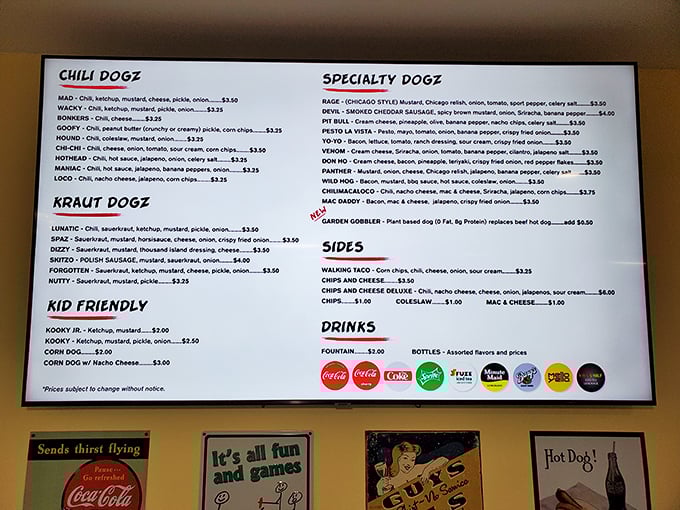 The menu board at Mad Dogz isn't just a list—it's a roadmap to hot dog nirvana with names like "Lunatic" and "Psycho" that perfectly telegraph what's about to happen to your taste buds.