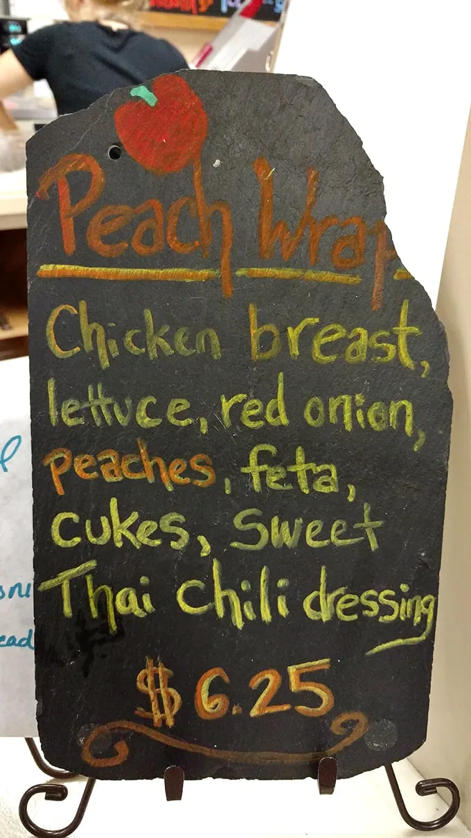 The Peach Wrap isn't just lunch—it's a flavor symphony where sweet peaches dance with savory chicken and that Thai chili dressing steals the show.