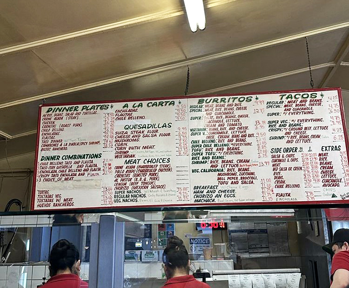 The menu board—a sacred text of Mexican delights. Study it carefully, grasshopper, for there are no wrong choices here.