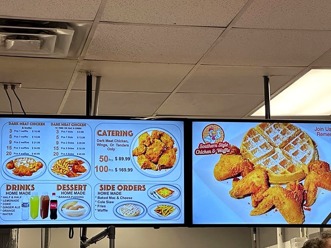 The menu board tells you everything you need to know—this place means serious business when it comes to fried chicken and waffles.