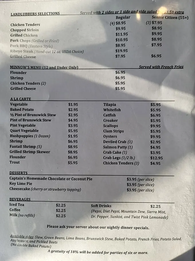 This menu isn't just a list—it's a treasure map where X marks the spot for seafood gold and "landlubber" options for those who prefer to keep their feet dry.