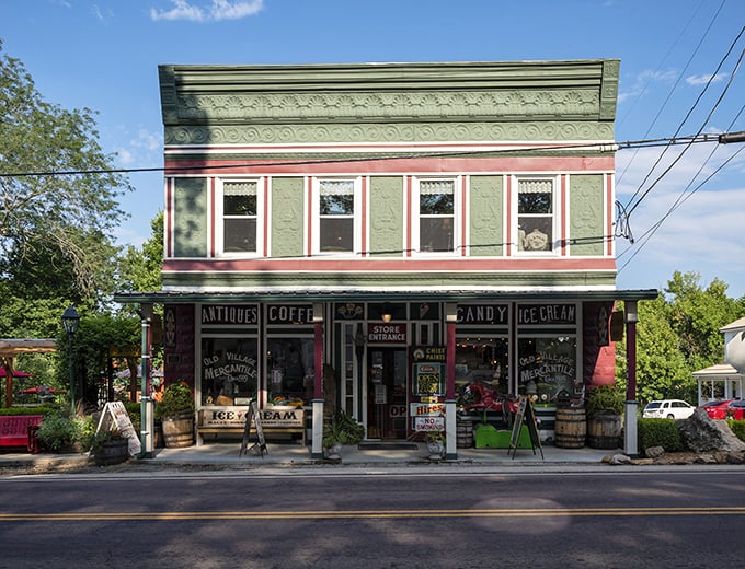 The Old Village Mercantile's mint-green facade isn't just a store – it's a time machine dispensing ice cream, coffee, and nostalgia.