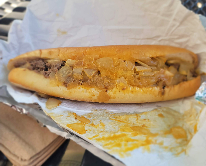 Behold the star of the show—thinly chopped steak and melted cheese cradled in a perfect roll. Poetry in sandwich form.