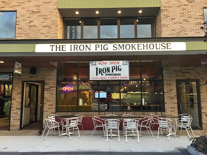 The Iron Pig Smokehouse beckons with promises of slow-cooked perfection – where outdoor seating lets you enjoy your BBQ with a side of people-watching.