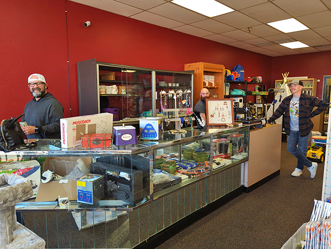 The glass display case houses the crown jewels of thrifting—those special finds deemed too valuable for regular shelf life.
