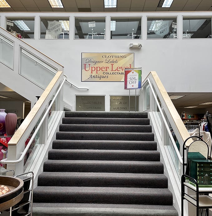 This stairway might as well be labeled "This Way to Hidden Treasures" – the upper level beckons with promises of designer finds and vintage collectibles.