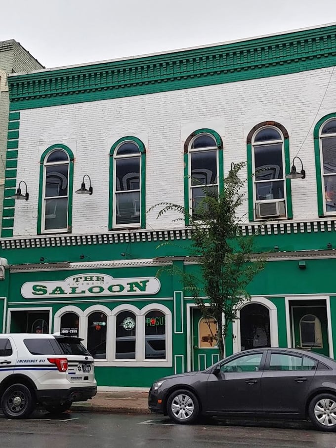The Saloon's distinctive green and white façade promises affordable libations and local conversation – the kind of place where everybody might actually know your name.