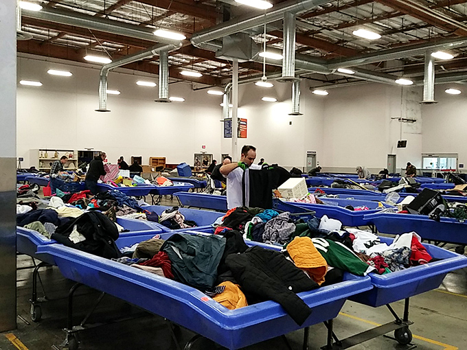 The famous blue bins—where fashion destinies are determined and style hunters develop biceps they never knew they needed.