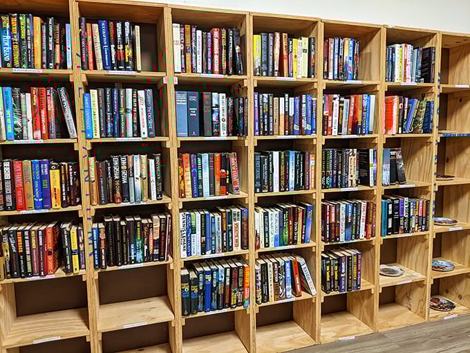 A bibliophile's dream realized in wooden shelves. Each book represents someone else's finished journey, waiting for you to begin yours at pocket-change prices.