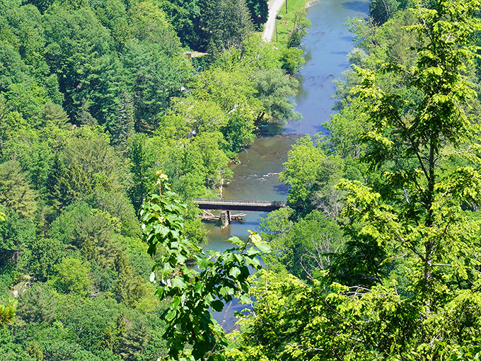 Penns Creek winds like a blue ribbon through the lush valley. From this height, even bridges look like toys in nature's playground.