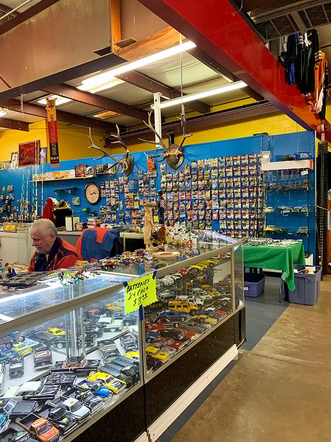 Miniature automotive dreams line these display cases. For collectors, this isn't just a booth—it's a museum where you can actually take the exhibits home.