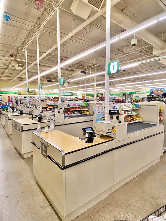 The checkout area gleams with efficiency – the final gateway between you and your bounty of budget-friendly finds.