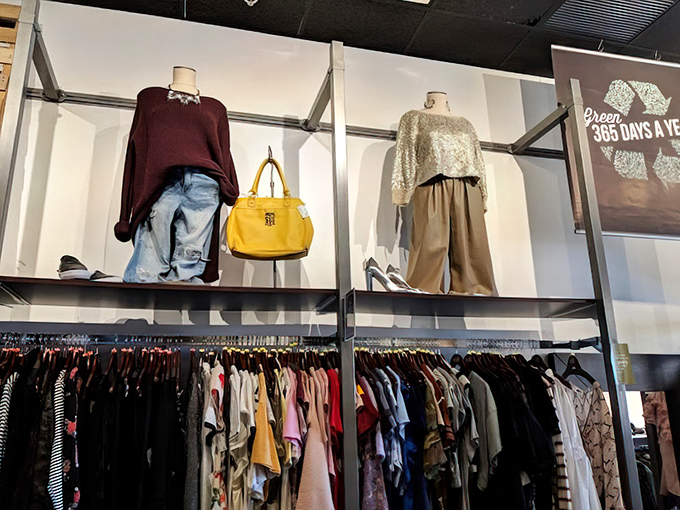 Perfectly styled mannequins showing off burgundy sweaters and that statement yellow bag – like visual fashion consultants who never judge your choices.